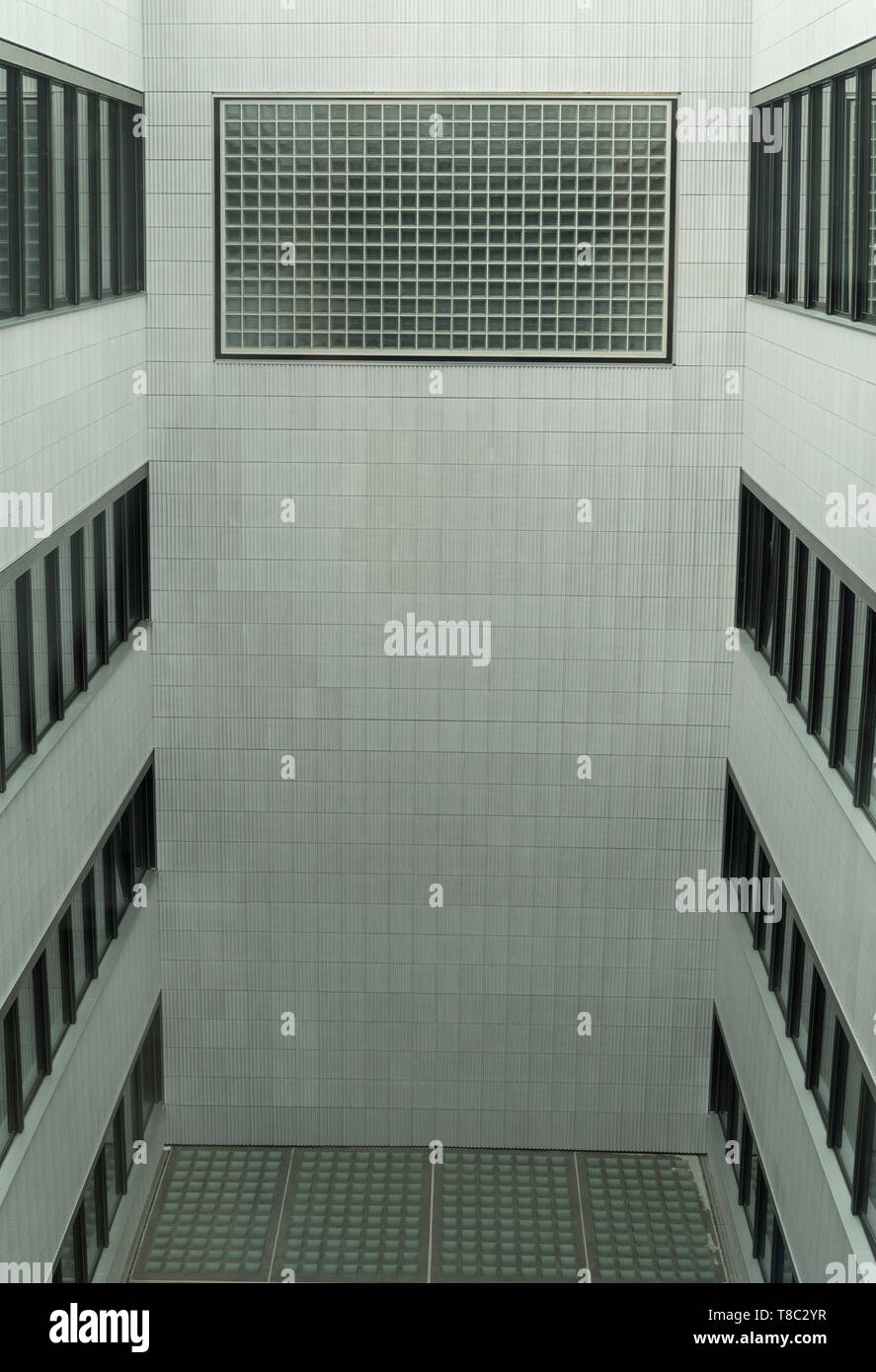 enclosed interior open courtyard in a modern multi-storey building with ...