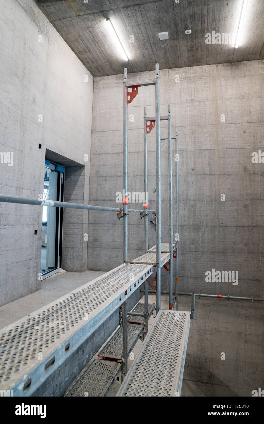 multi-level scaffolding in a concrete stairwell of an unfinished ...