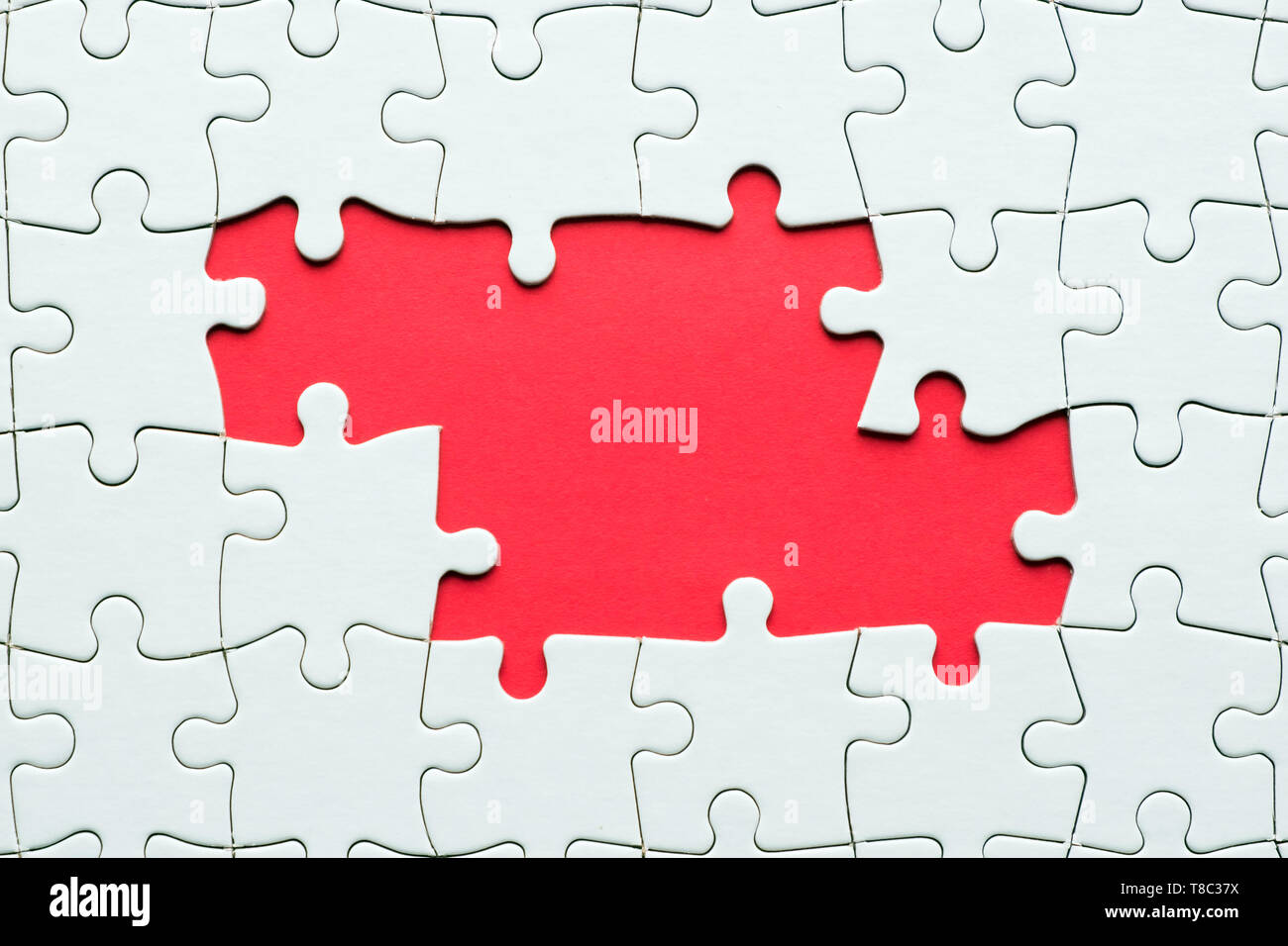 Jigsaw puzzle game piece on red background for business theme design ...