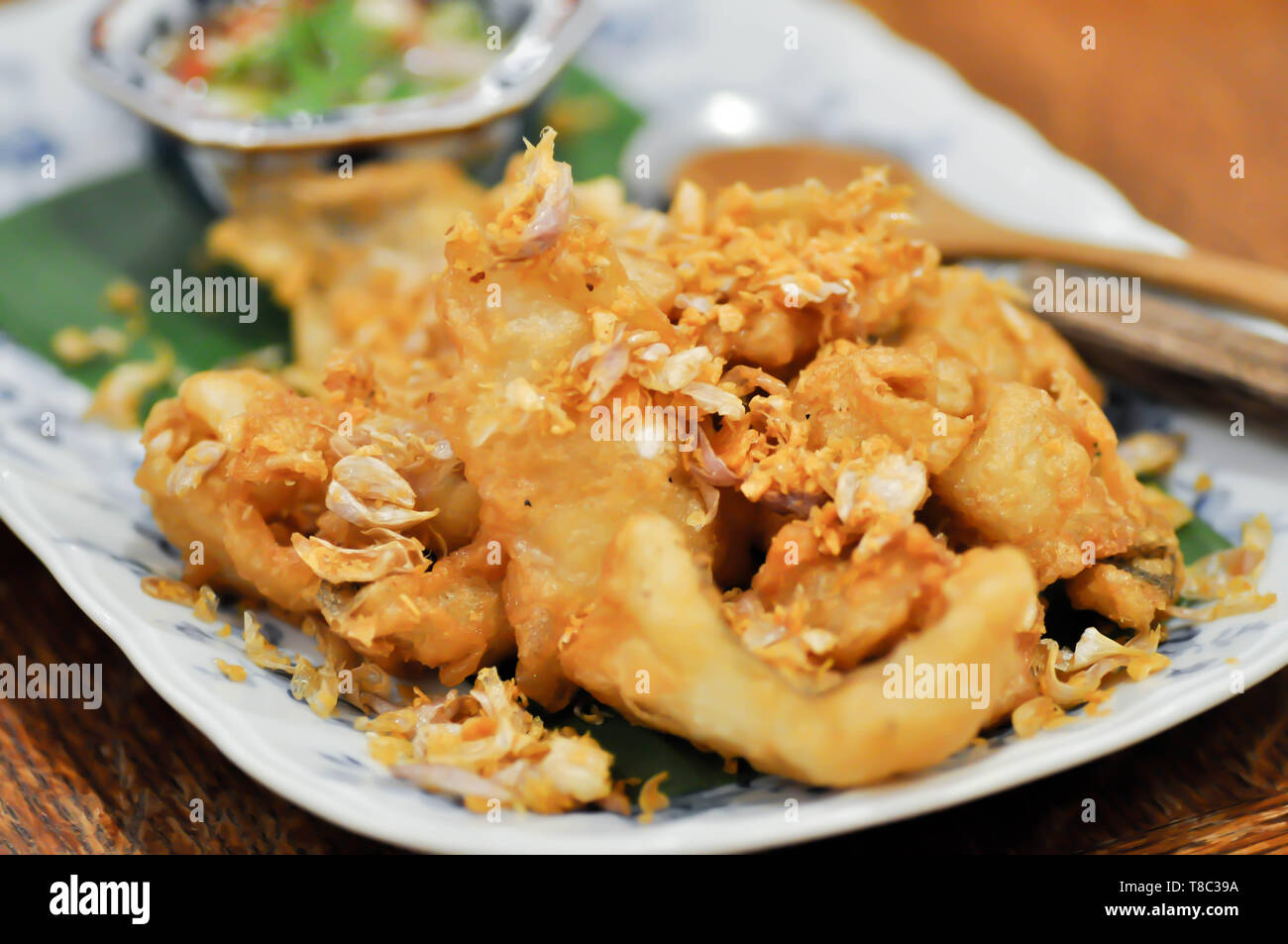fried sliced fish or fried fish with fied garlic Stock Photo - Alamy