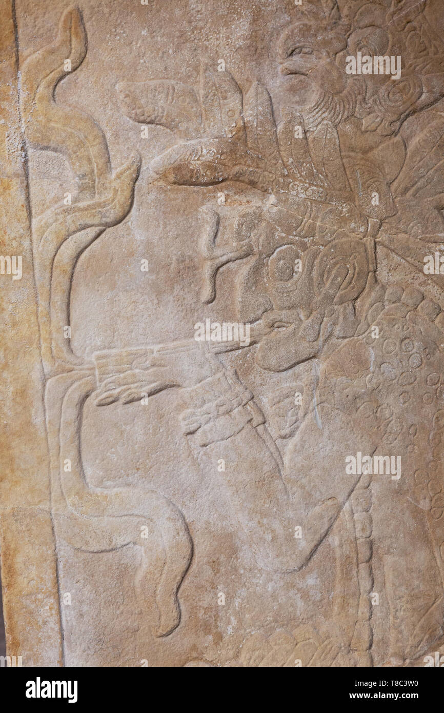 Mayan art - stone carving bas relief of a mayan man smoking a pipe ...