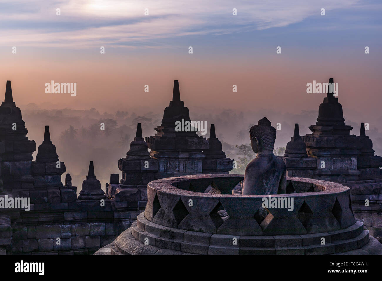 Buddha statue at sunrise, Borobudur temple complex, Borobudur ...