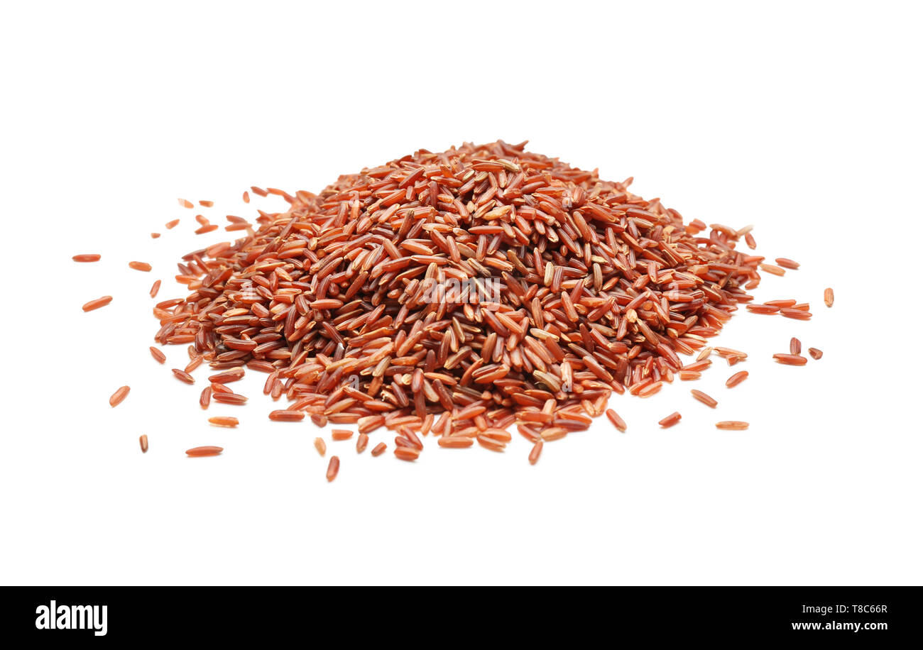 Pile of red rice on white background Stock Photo - Alamy