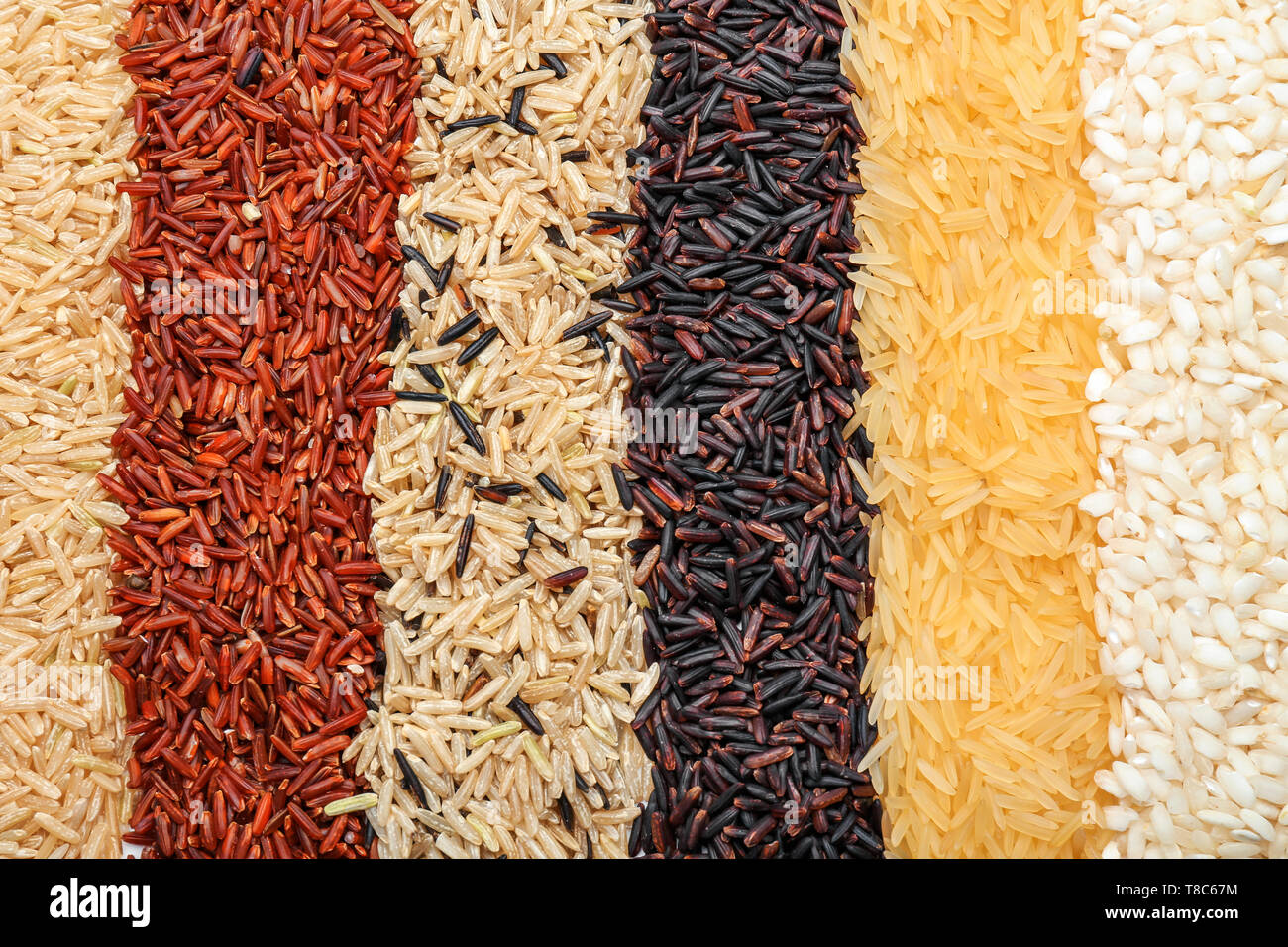 Different types of rice as background Stock Photo - Alamy