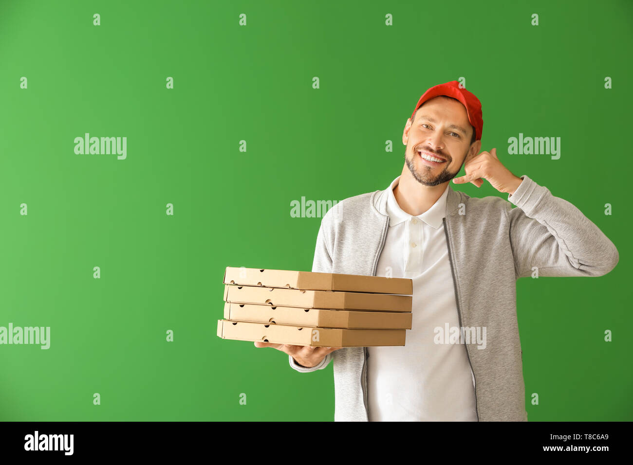 Man with pizza boxes on color background. Food delivery service Stock ...