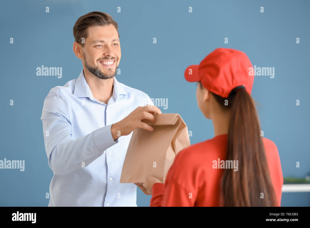 Woman delivering food hi-res stock photography and images - Alamy