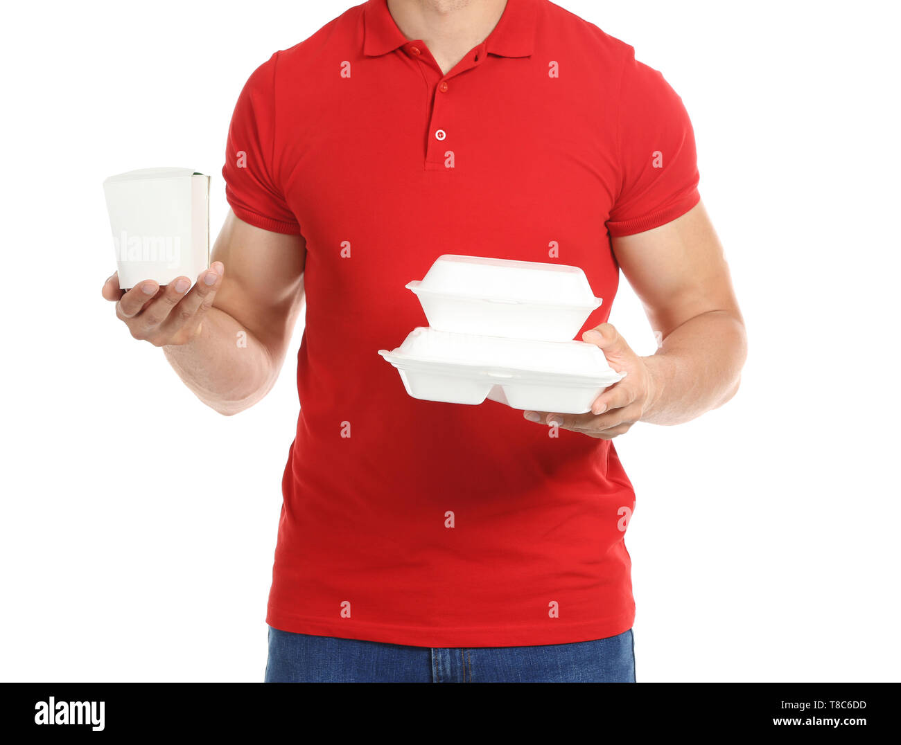 Young man with plastic containers and paper box on white background ...