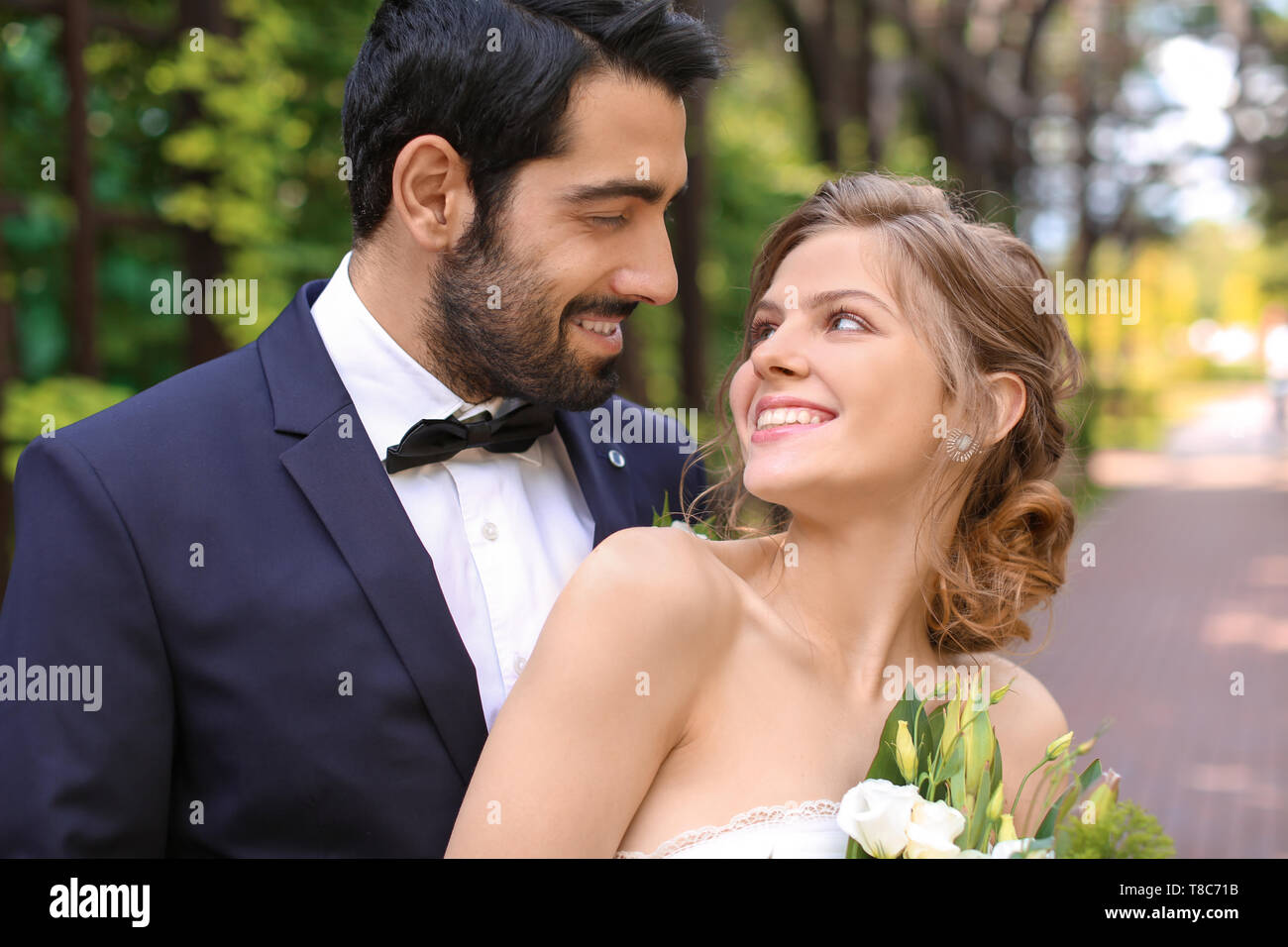 Lovely young newlyweds bride groom hi-res stock photography and images ...