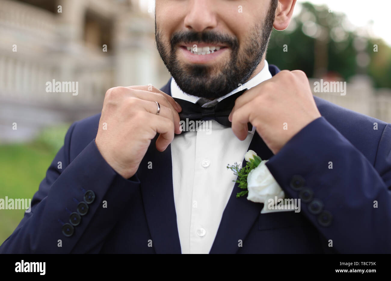 Fixing bow tie hi-res stock photography and images - Alamy