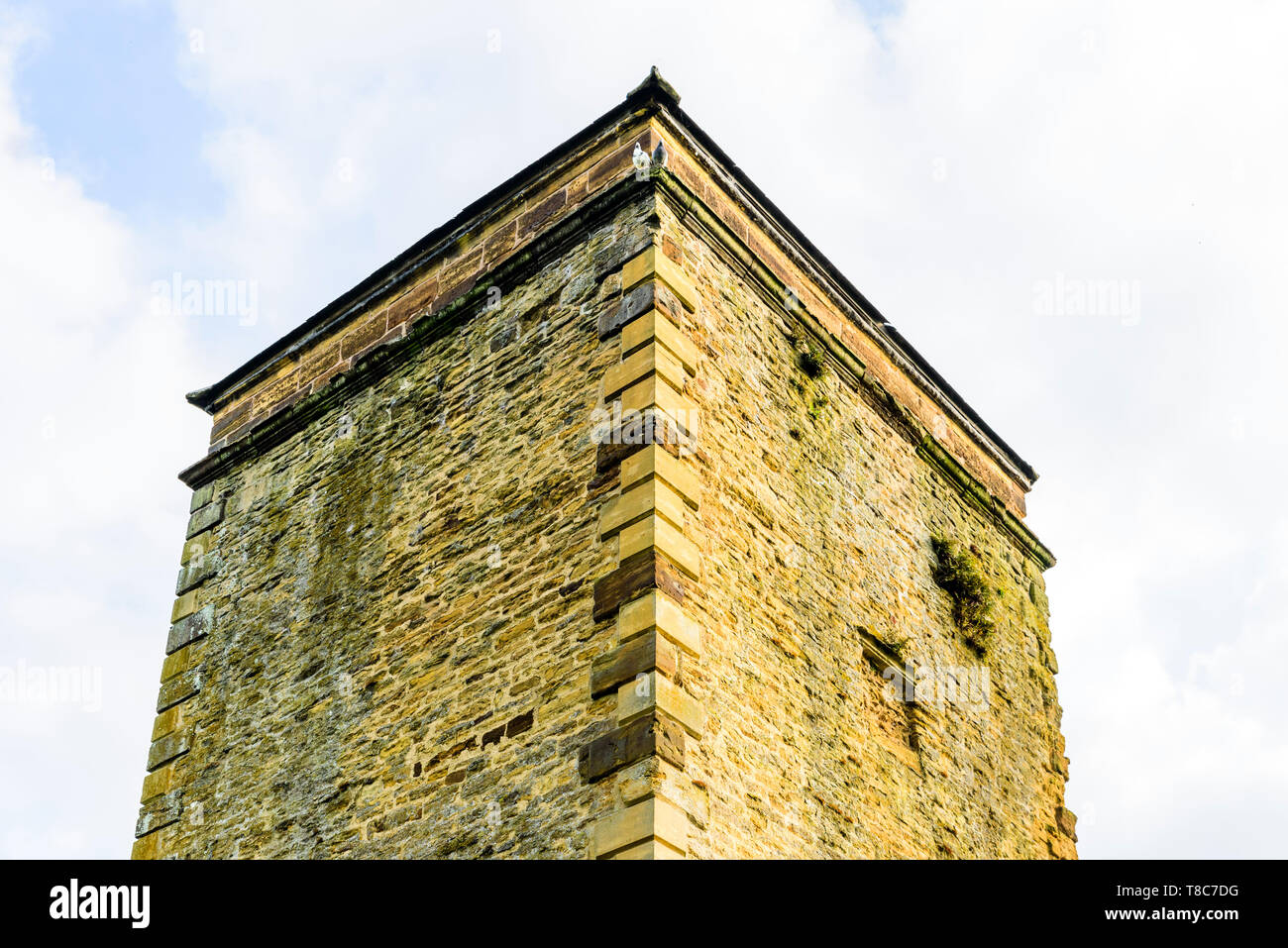 old castle tower wall with sky on background in uk Stock Photo - Alamy