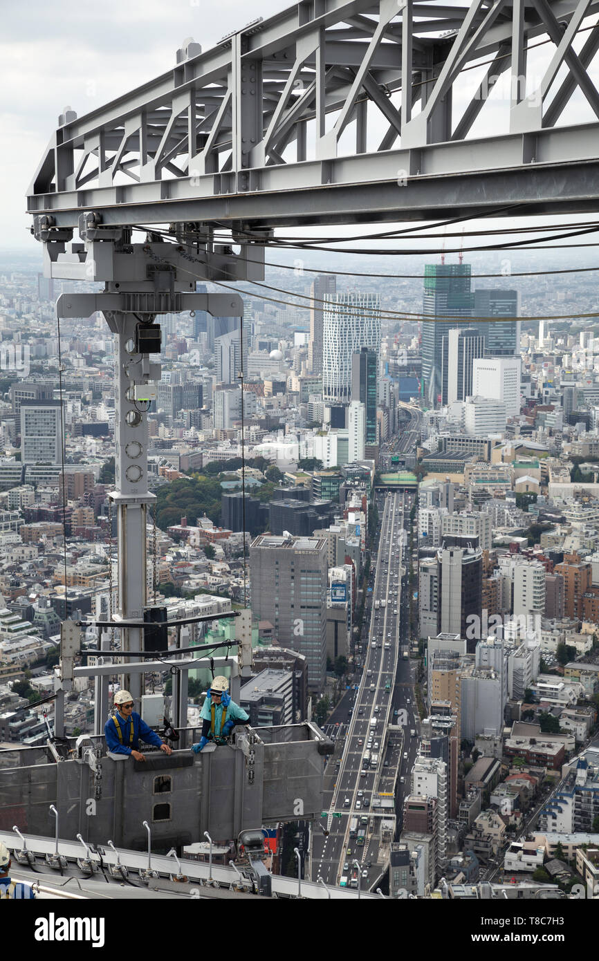 tokyo,japan - oct,9,2018:worker cleaning the window of the high ...
