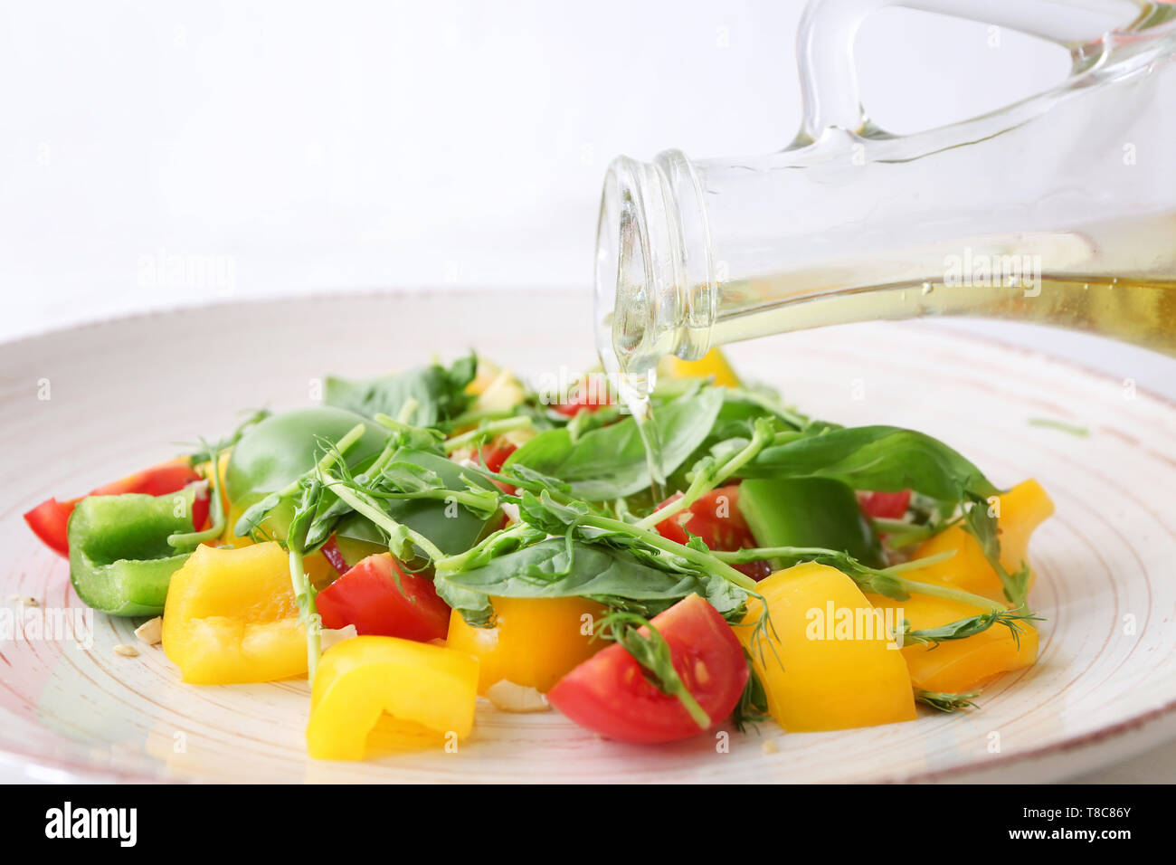 Closeup pouring salad vegetables hi-res stock photography and images ...