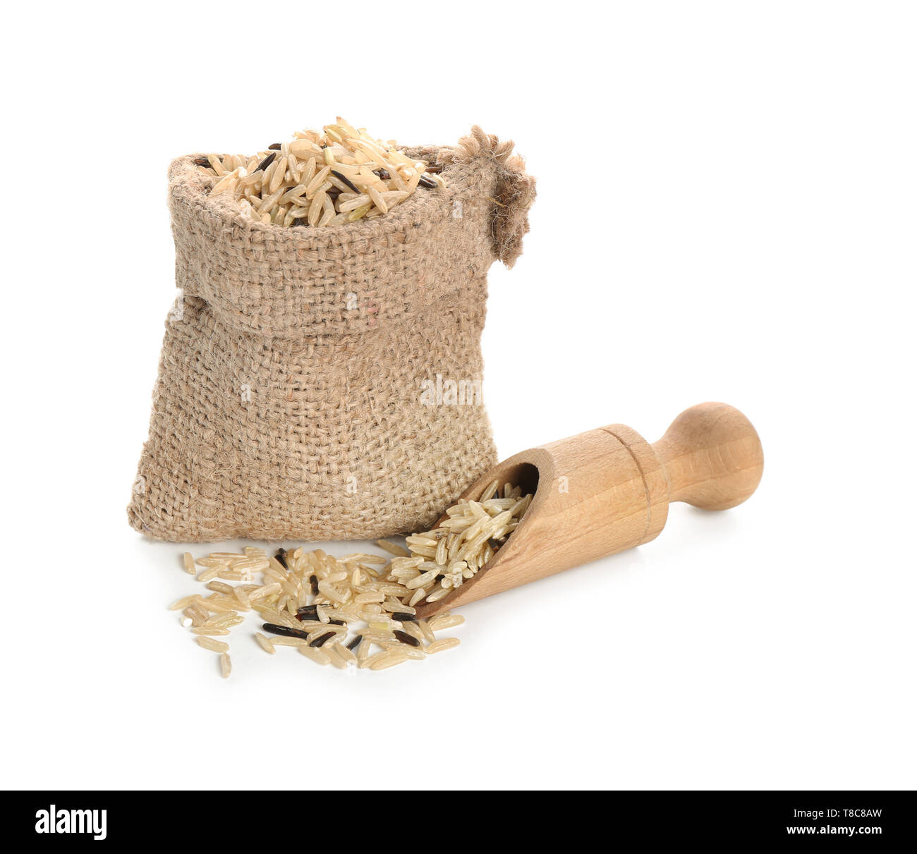 Bag and scoop with raw rice on white background Stock Photo - Alamy