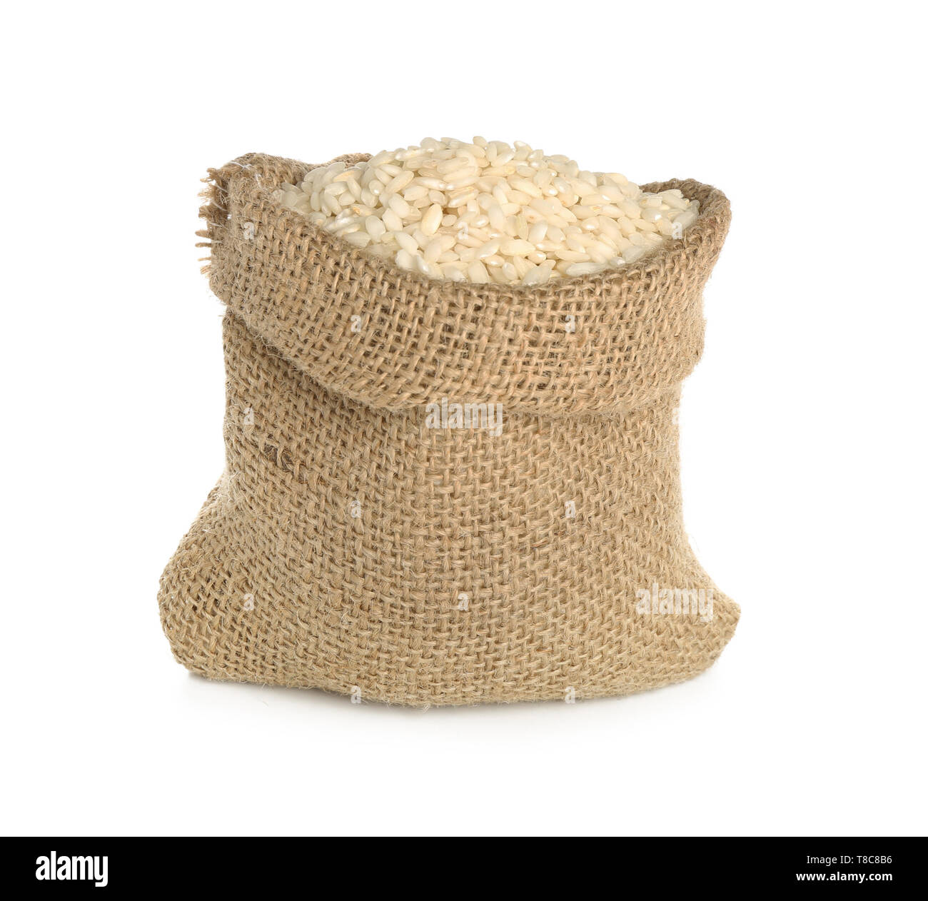 Bag with raw rice on white background Stock Photo - Alamy