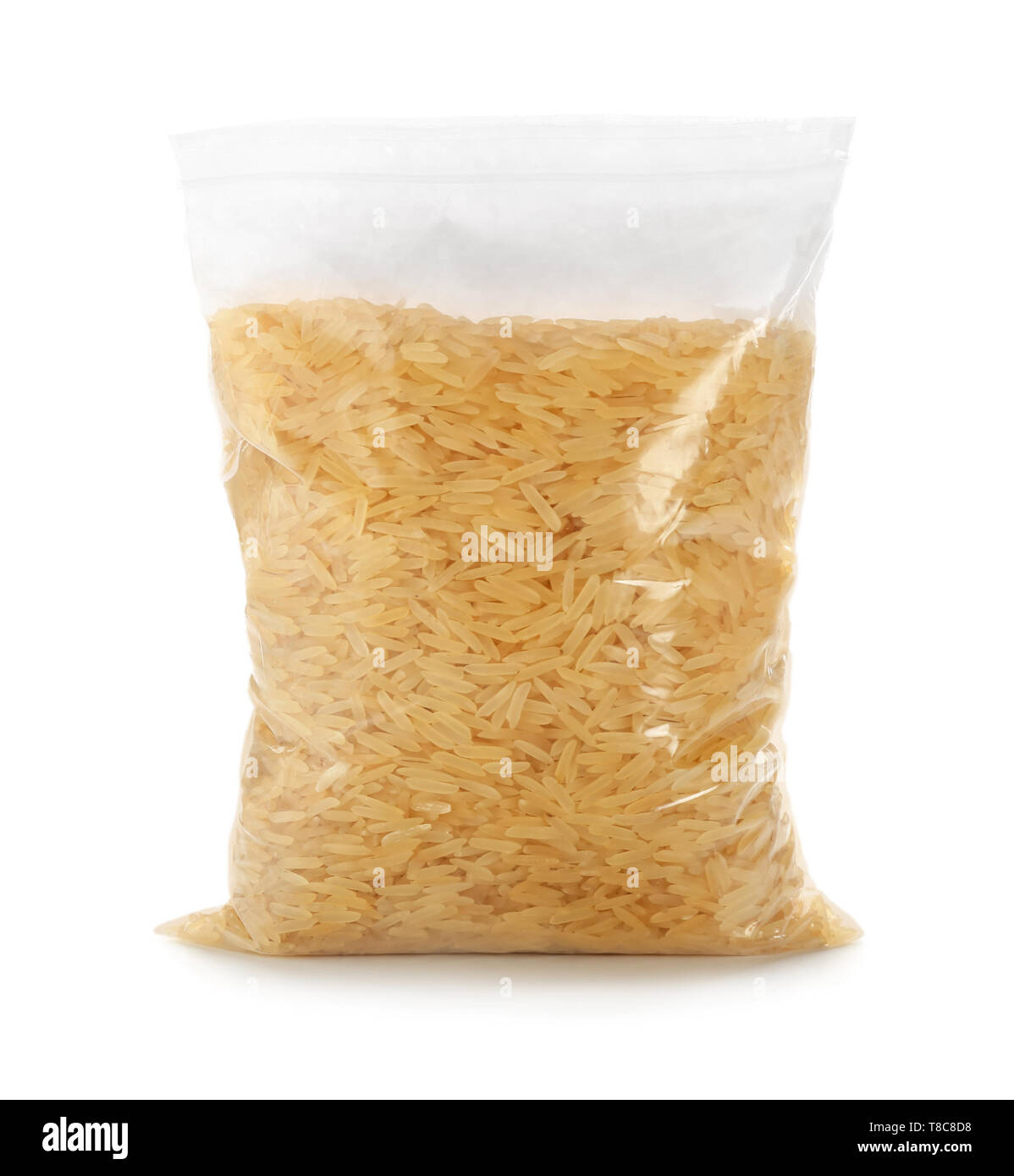 Zipper bag with raw brown rice on white background Stock Photo - Alamy