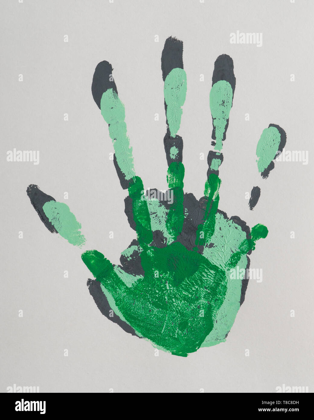 the imprint three palms on paper, one on top of another Stock Photo - Alamy