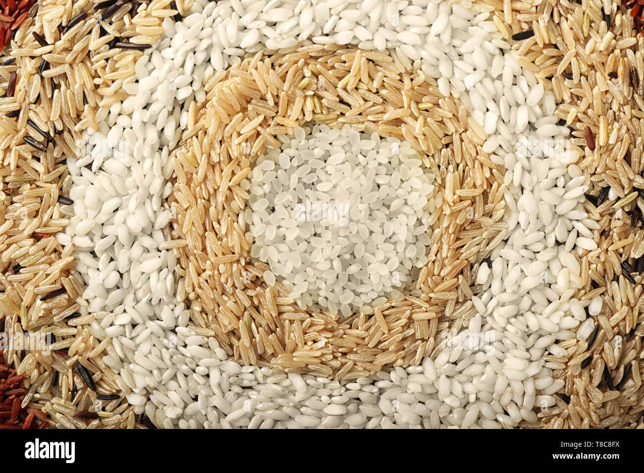 Composition with different types of rice, closeup Stock Photo - Alamy