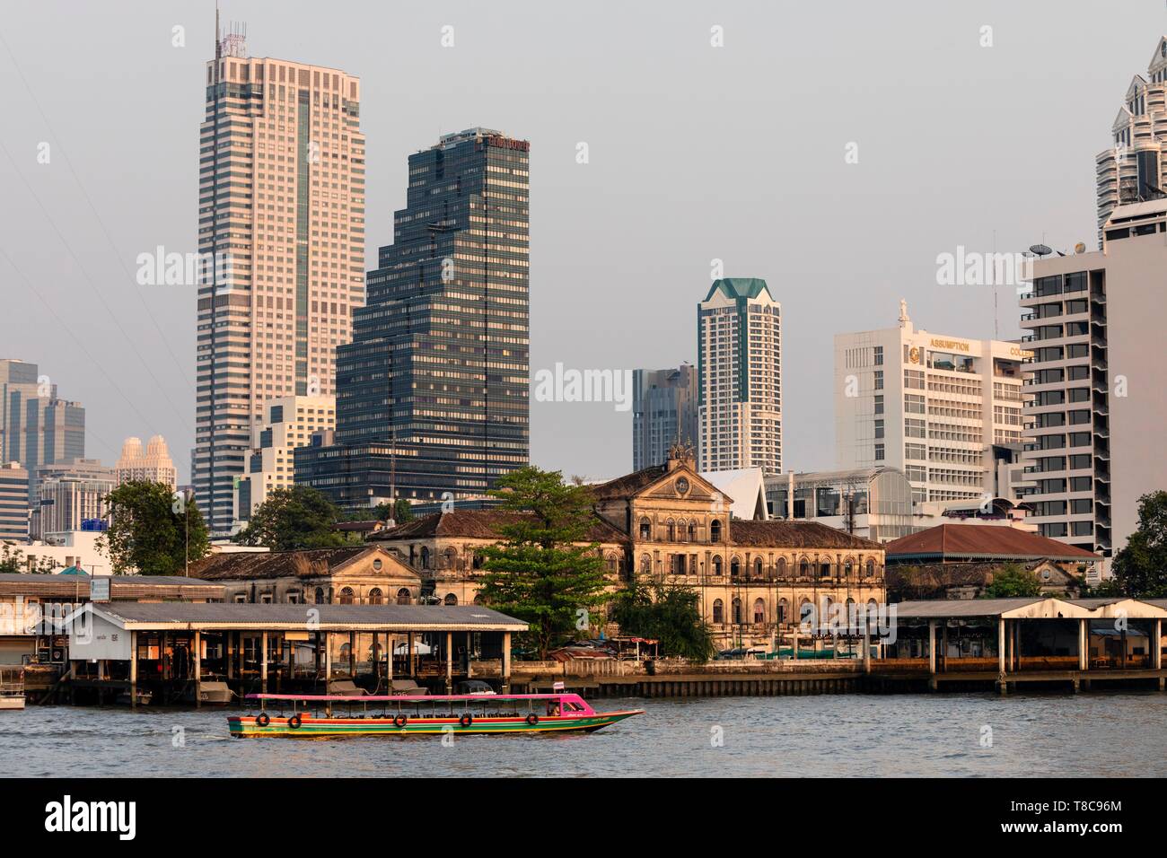 Skyline of the Bang Rak district, front old fire station Bangrak, boat ...