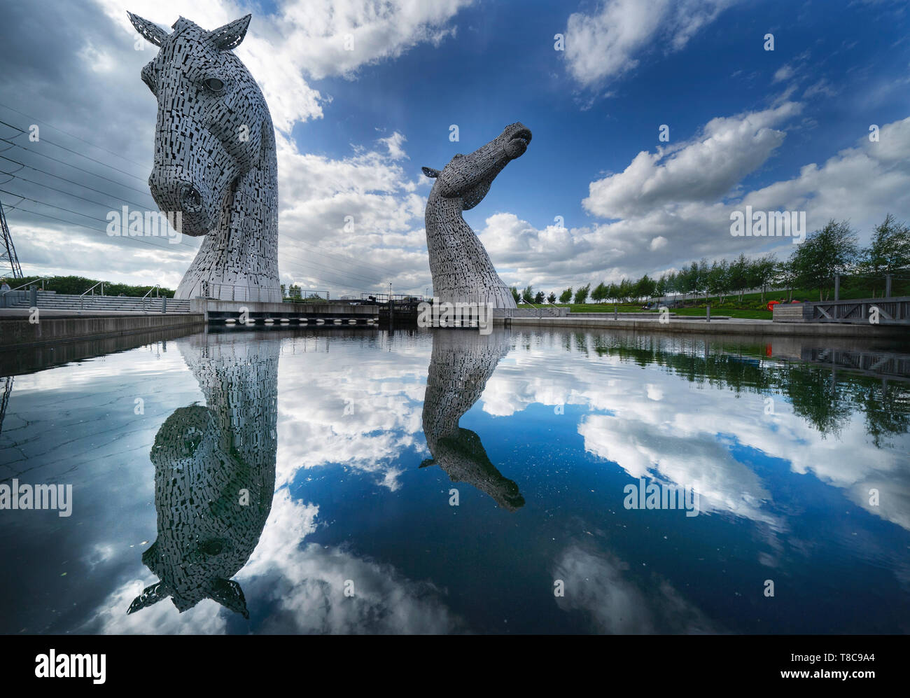 People enjoy the sun at The Kelpies in Falkirk, Scotland Stock Photo ...