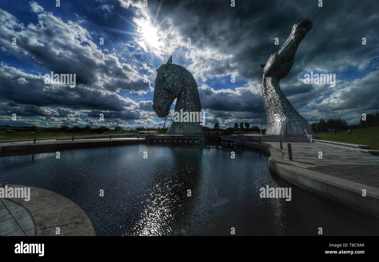 People enjoy the sun at The Kelpies in Falkirk, Scotland Stock Photo ...