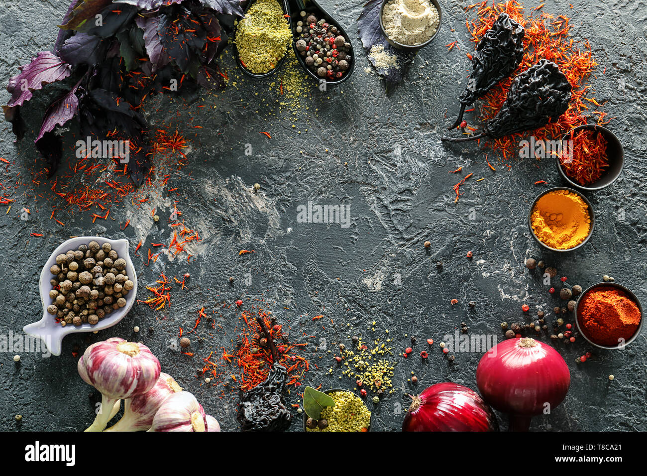 Frame made of different spices on grey textured background Stock Photo ...