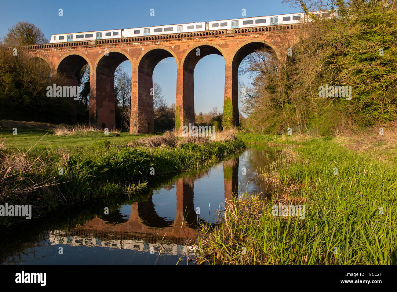 A train crosses Eynsford viaduct over the River Darent in Kent on a ...