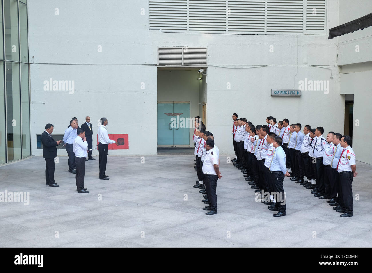 Security guard talking hi-res stock photography and images - Alamy