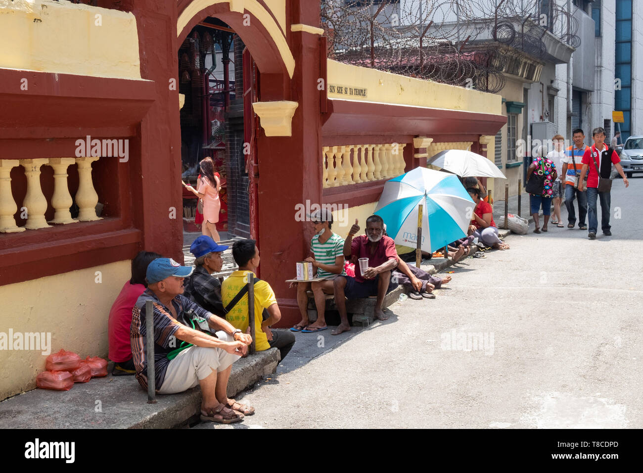 Beggar outside temple hi-res stock photography and images - Alamy