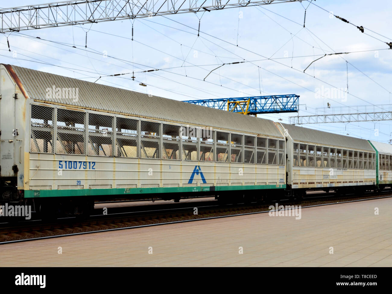 Cargo train with convertible multi-deck automotive wagon. Car-carrying ...