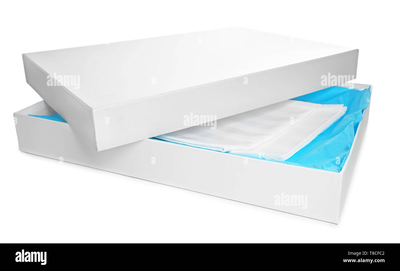 New bedding set in box on white background Stock Photo - Alamy