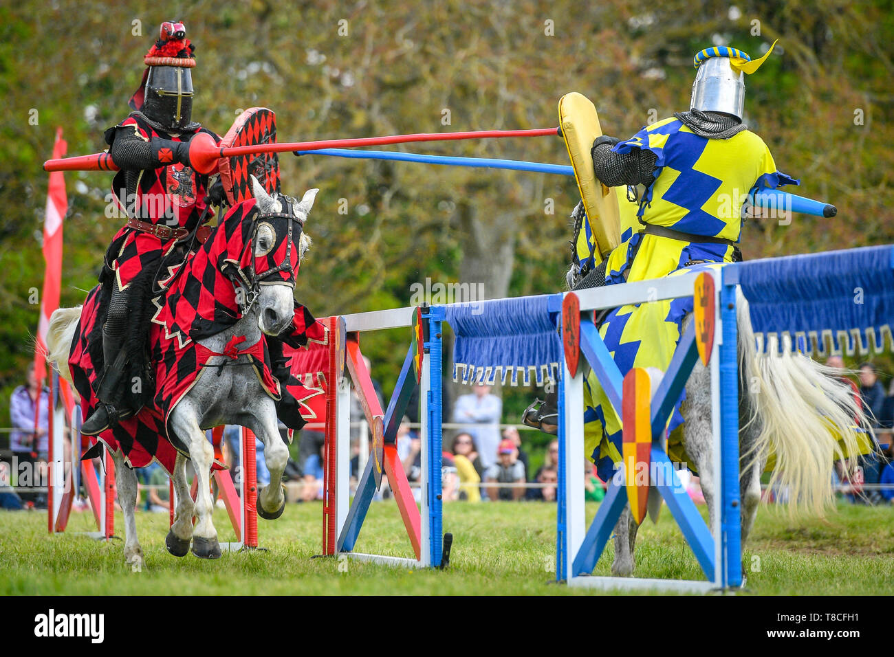 The red knight and blue knight face off as they gallop along the tilt ...