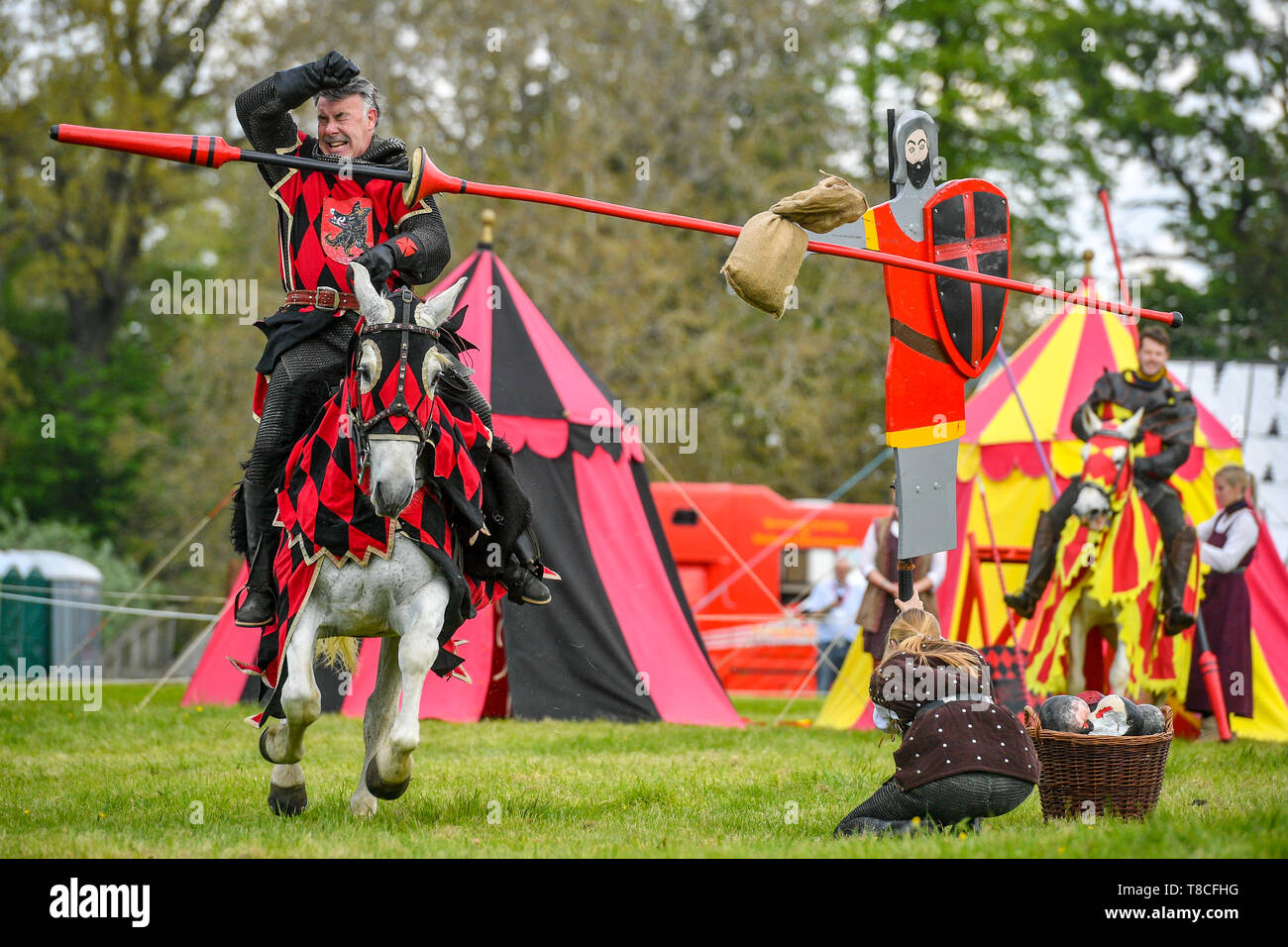 The red knight looses his lance during a jousting performance at ...