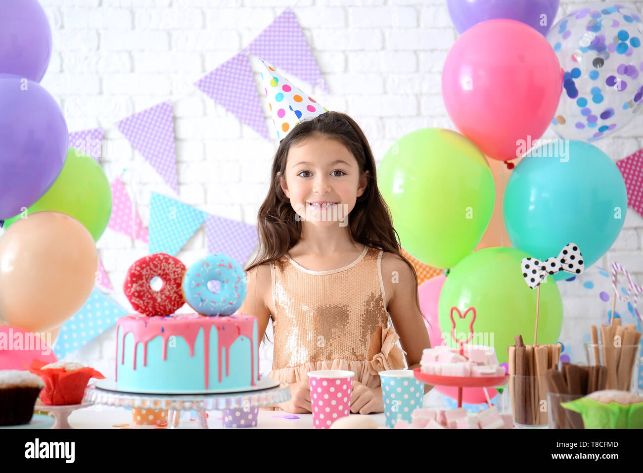 Cute little girl celebrating Birthday at home Stock Photo - Alamy