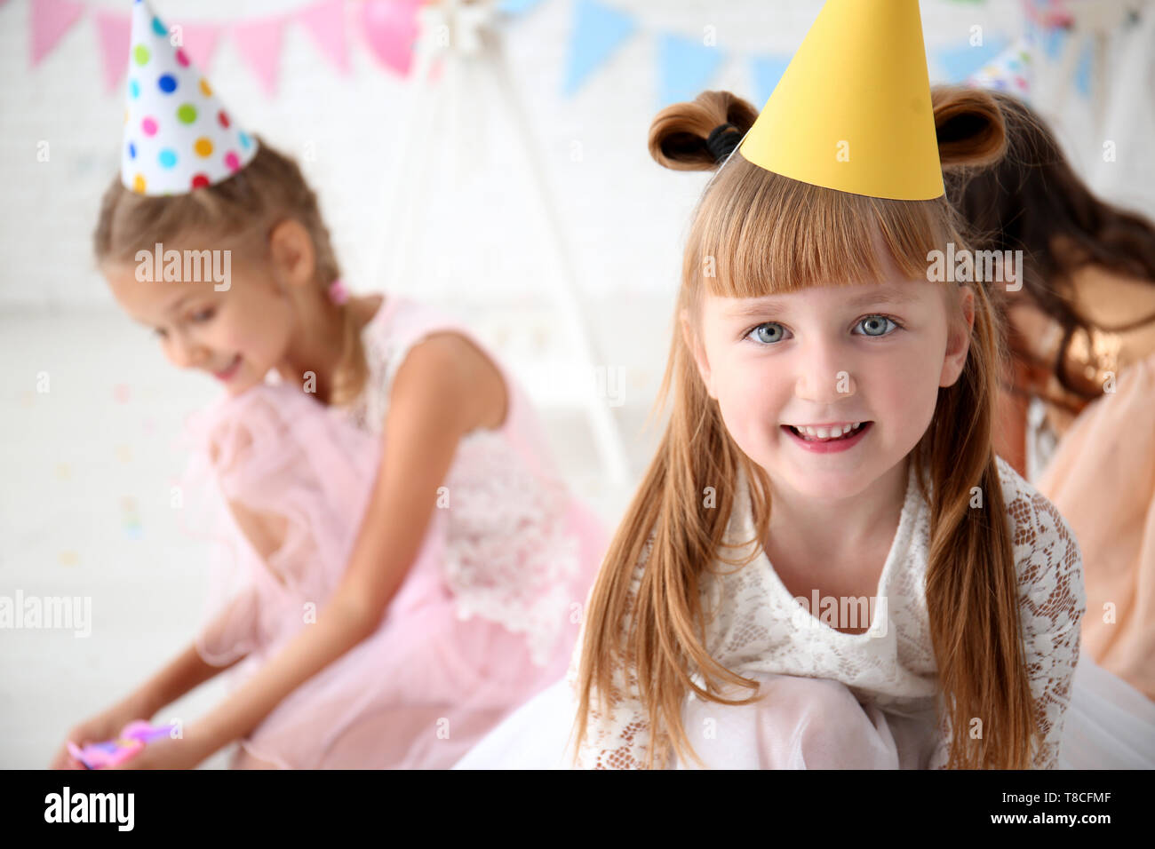Cute little girls celebrating Birthday at home Stock Photo - Alamy