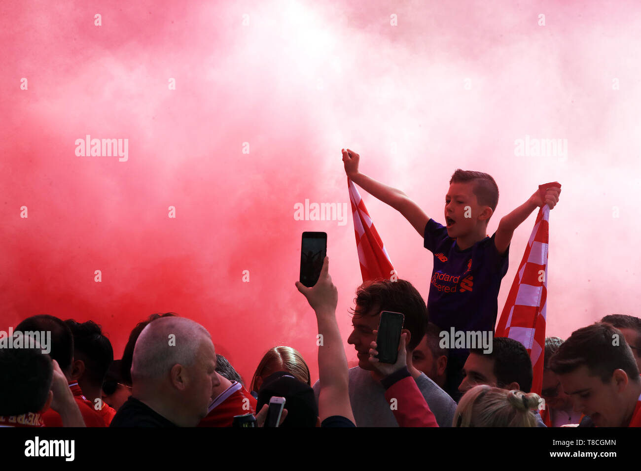 Liverpool fans let off flares before the Premier League match at ...