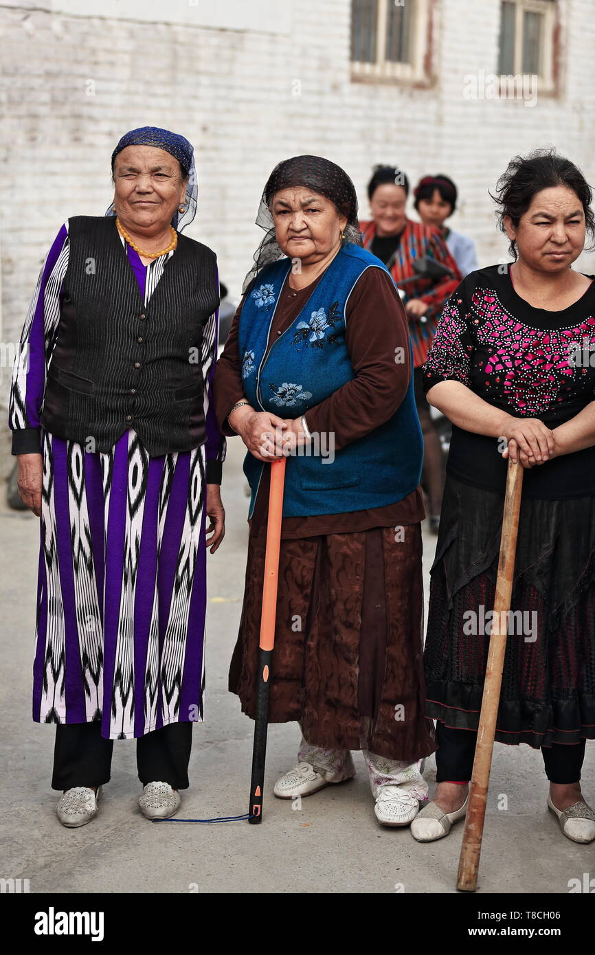 Trio of Uyghur women in traditional attire. Hotan-Xinjiang-China-0129 ...