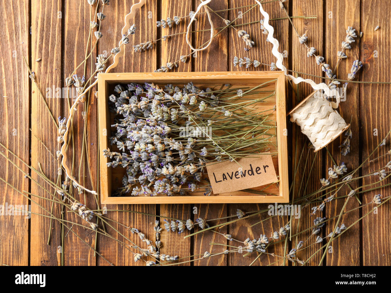 Box with beautiful lavender flowers on wooden table Stock Photo - Alamy