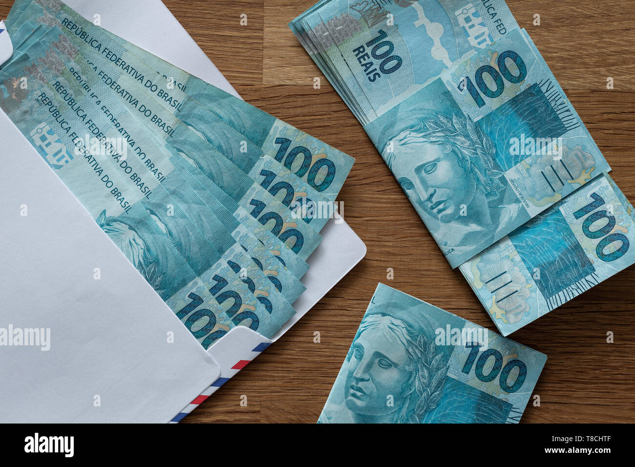 brazilian money in an envelope of high denominations Stock Photo - Alamy