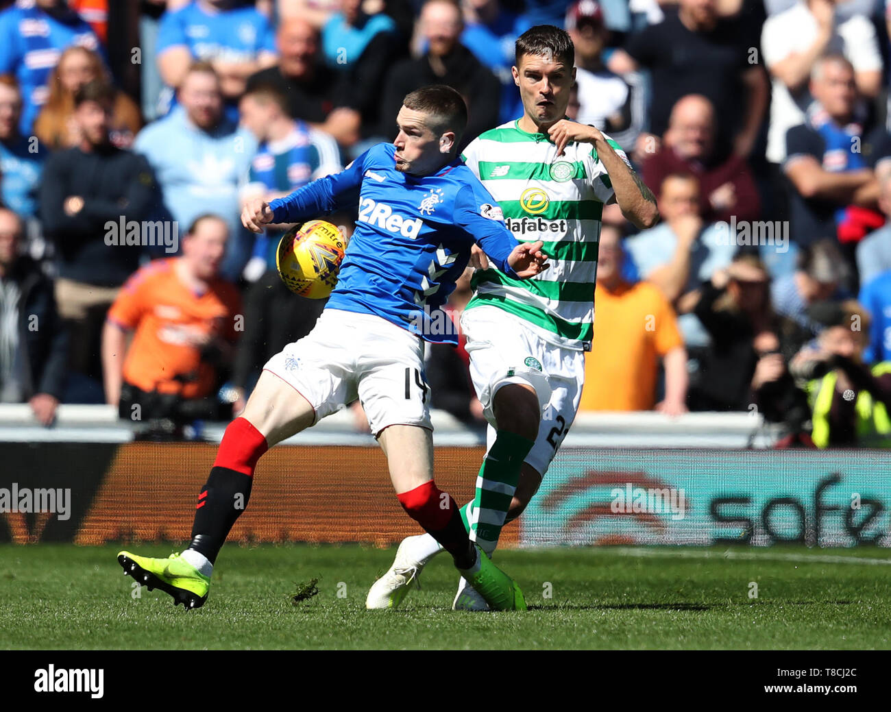 Rangers Ryan Kent (left) challenges Celtic's Mikael Lustig during the ...