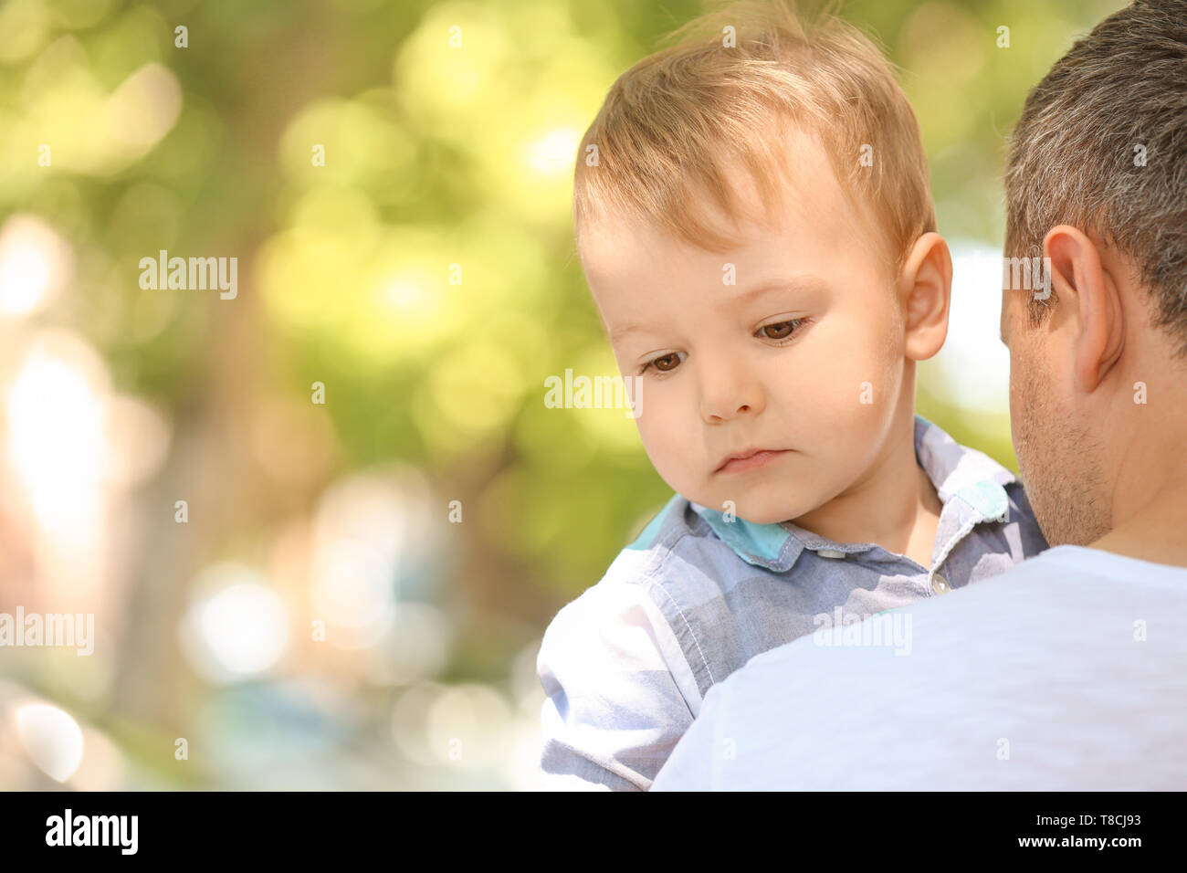 Cute little boy and his father outdoors Stock Photo - Alamy