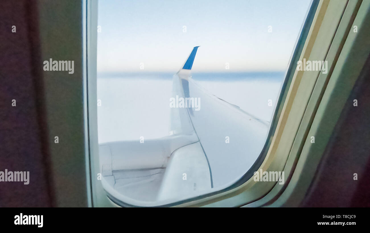 View from the window seat of commercial passenger airplane Stock Photo ...