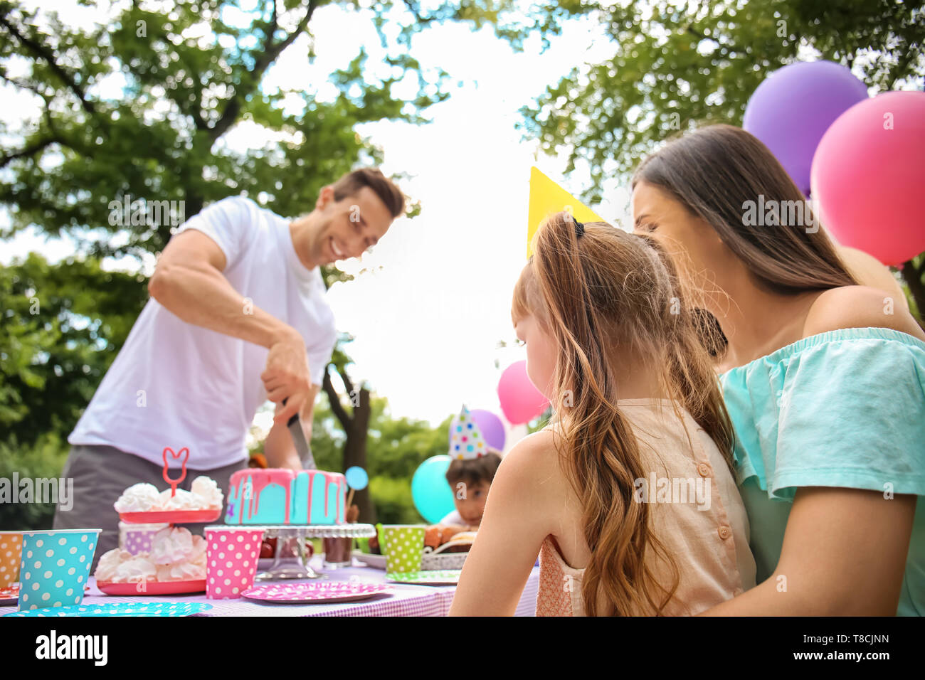 Child cutting birthday cake hi-res stock photography and images - Alamy