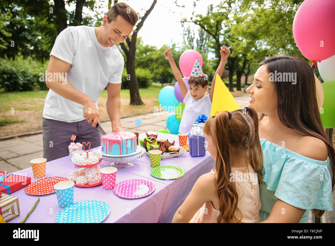 Father son cutting birthday cake hi-res stock photography and images ...