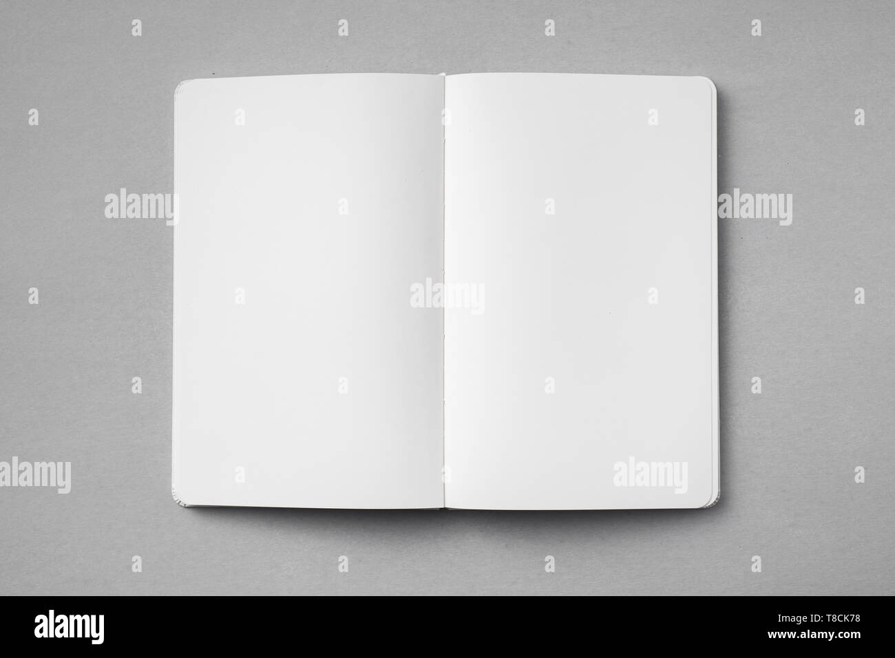 Design concept - top view of open white notebook with blank page ...