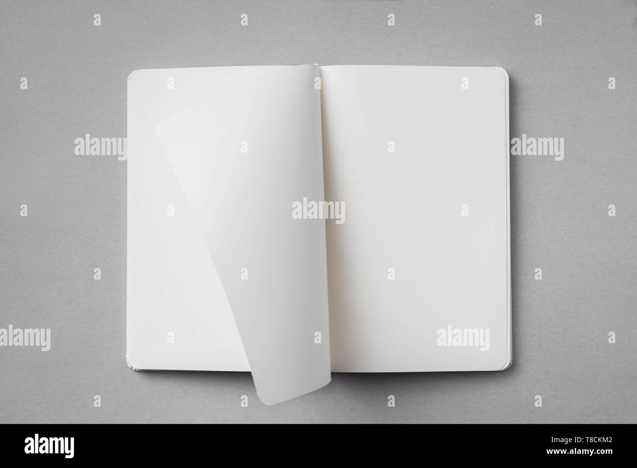 Design concept - top view of white notebook with blank open, turn and ...