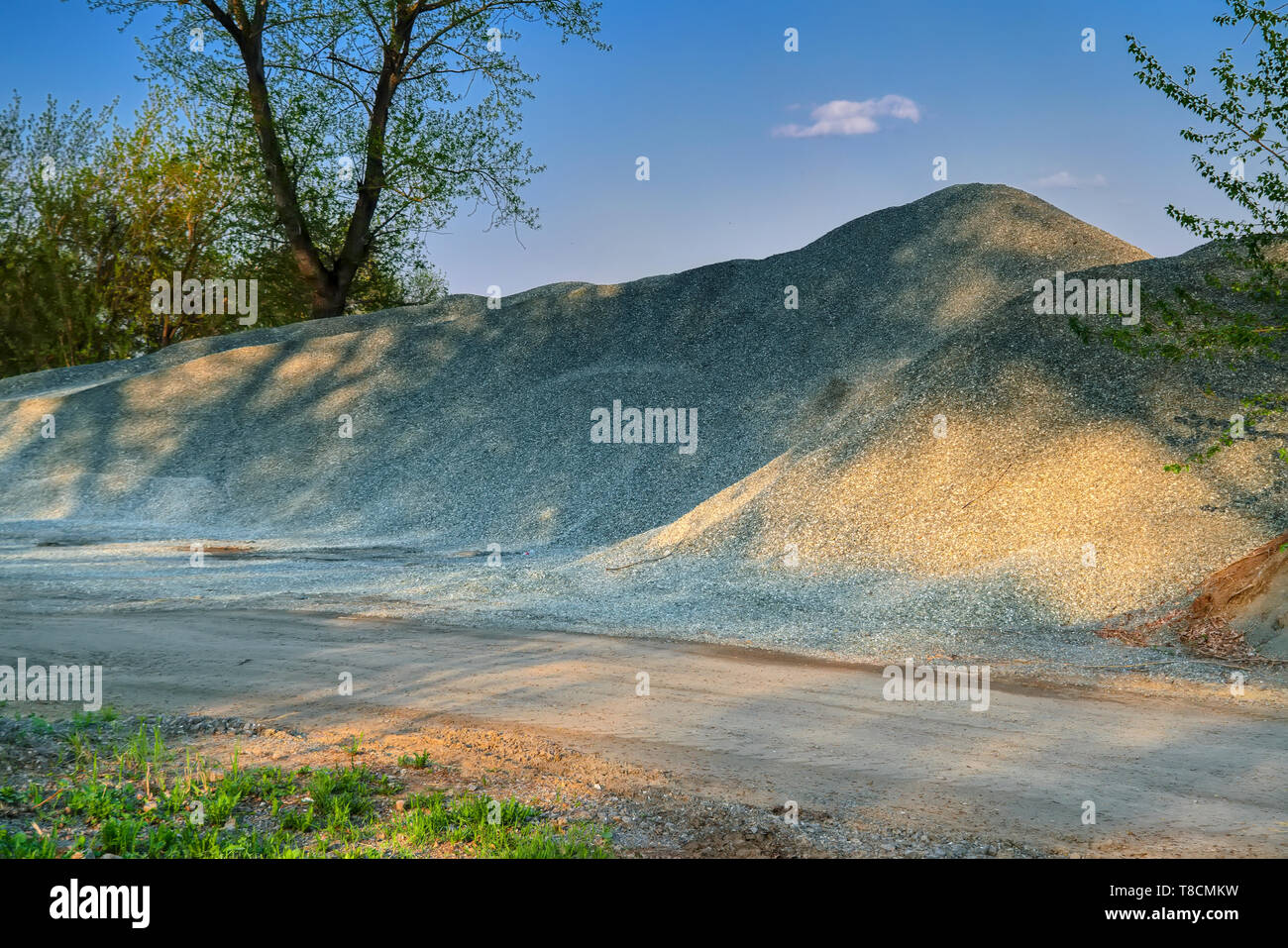Industrial background with pile of gravel. Extraction of gravel. Piles ...
