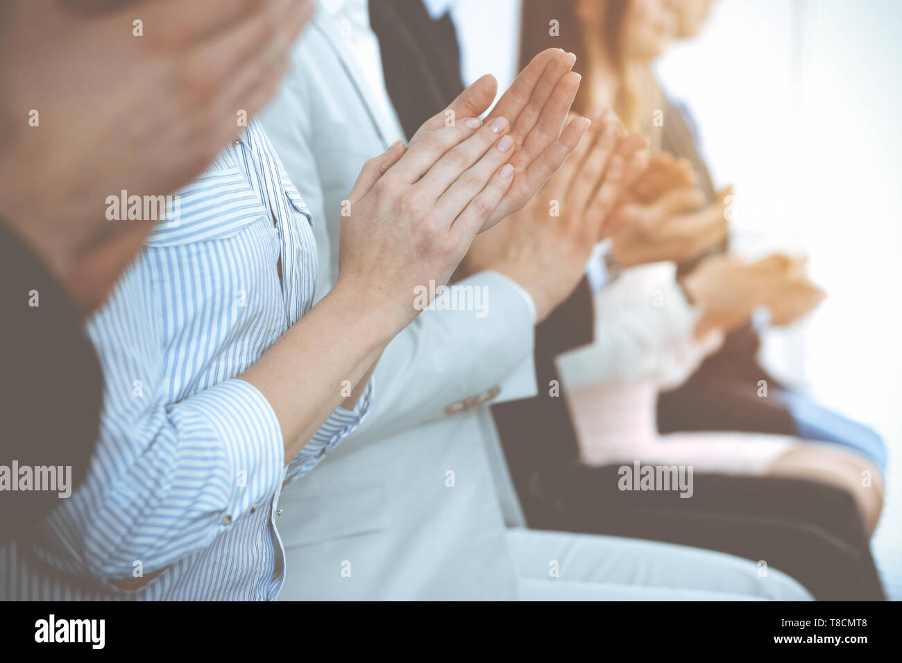 Business people clapping and applause at meeting or conference, close ...