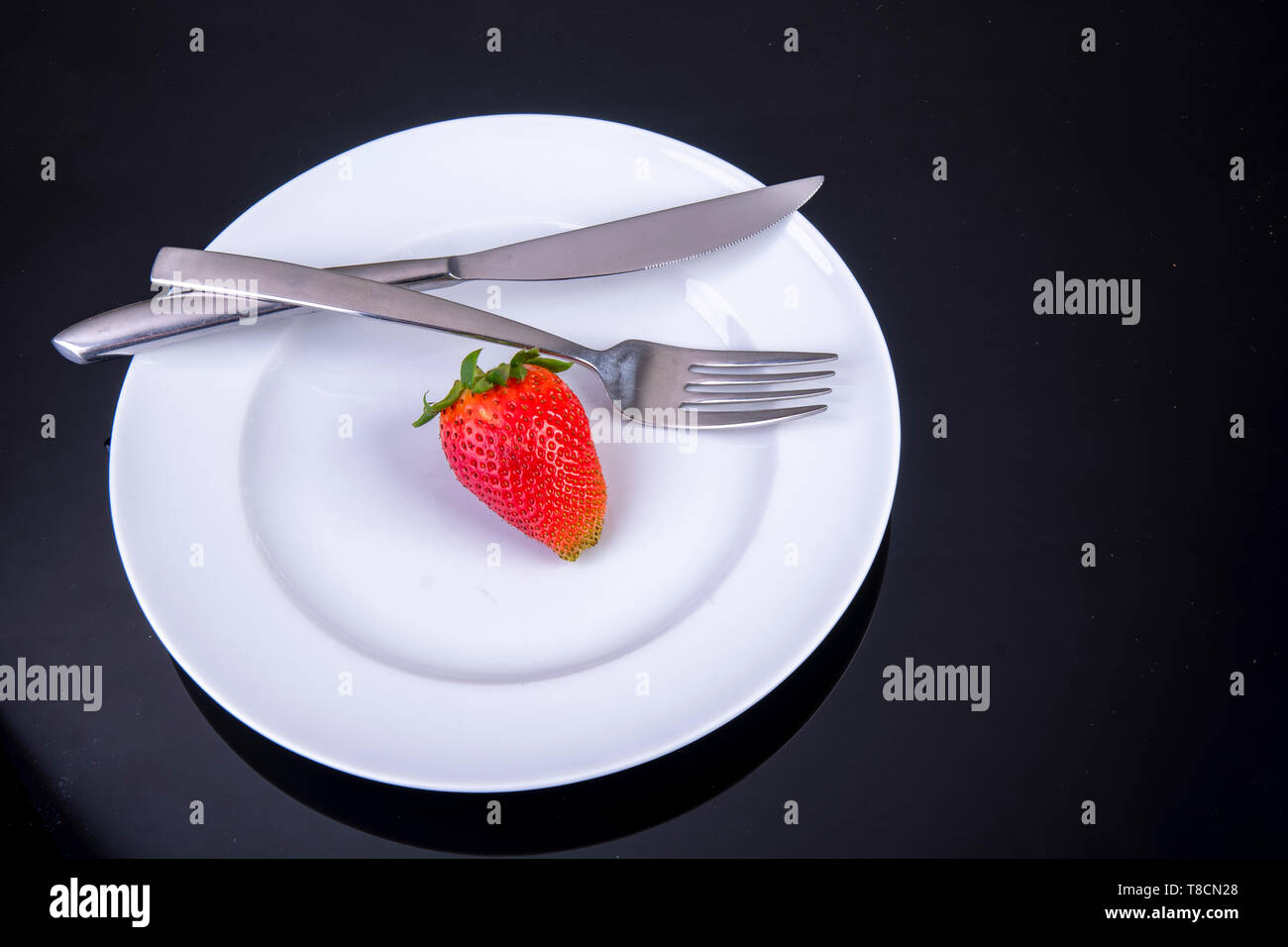 Lonely Strawberry High Resolution Stock Photography and Images - Alamy