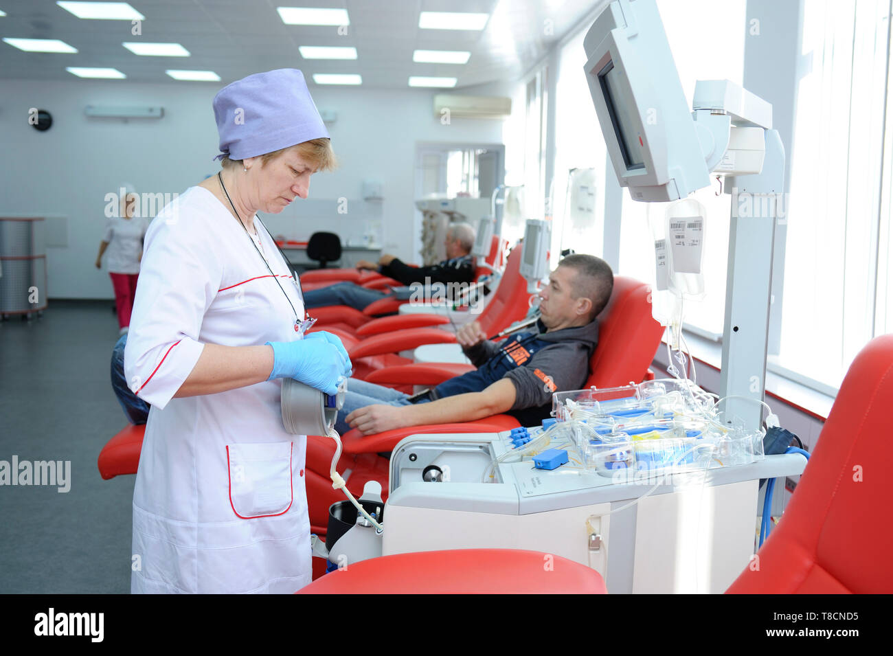 At the City (municipal) blood transfusion station. Nurse preparing ...