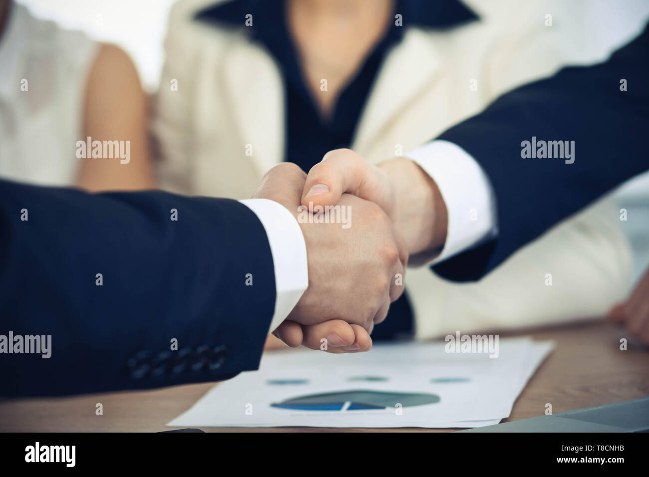 Business people shaking hands at meeting or negotiation in the office ...